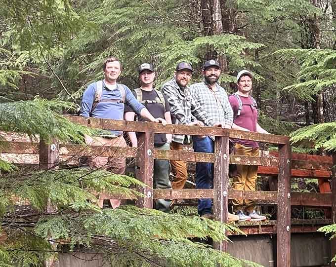 Nothing says "we conquered nature" quite like five friends posing on a bridge, pretending they're not already thinking about lunch.