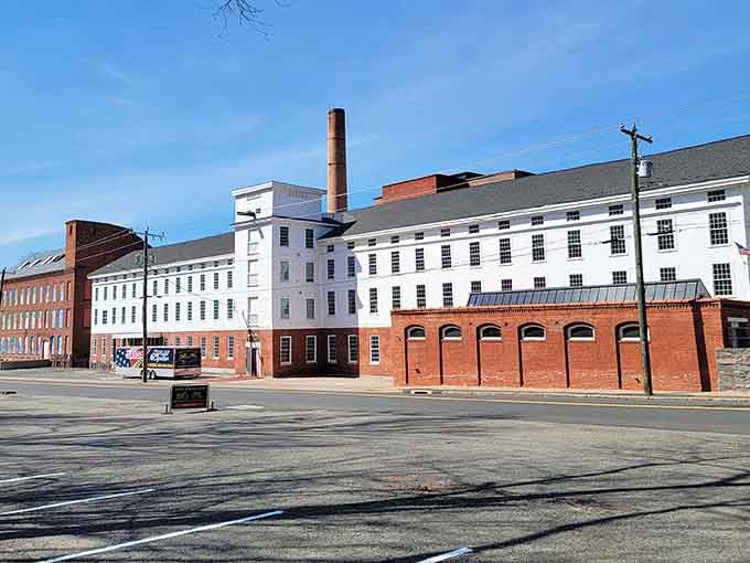 Historic mill buildings showcase Vernon's industrial heritage, standing proud like architectural time capsules along the streetscape.