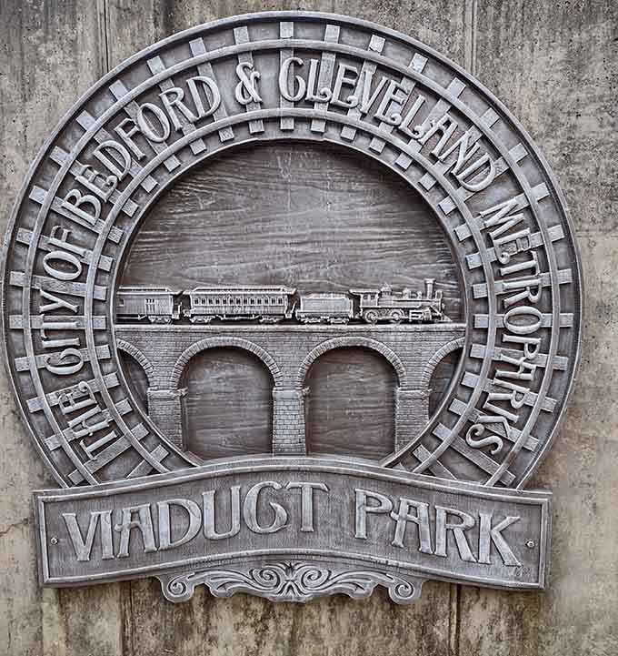 The historic plaque tells the story of the railroad viaduct that once stood here, connecting communities and commerce.