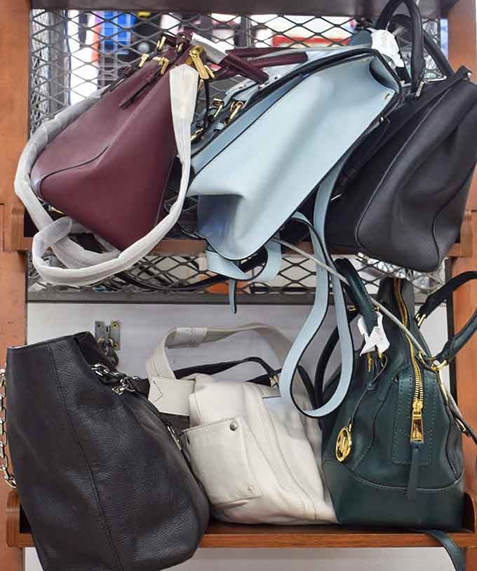 Handbags in every color waiting for someone to give them a second chance at glamour.