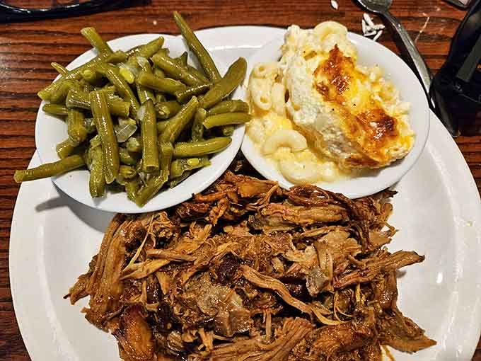 Tender pulled pork with mac and cheese and green beans proves that Southern sides deserve equal billing with the main attraction.