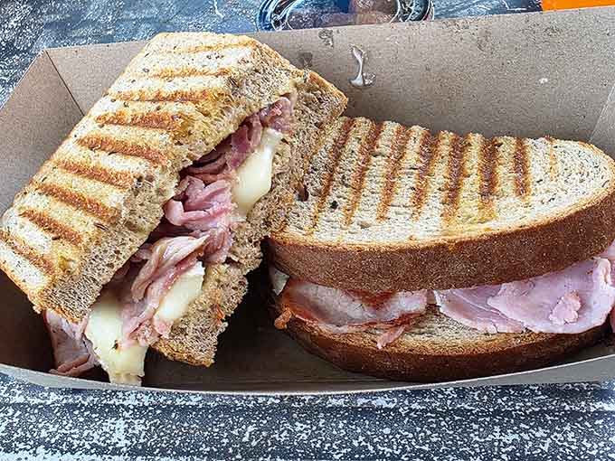 Hot Ham & Brie on grilled bread: proof that simple ingredients become magic in the right hands.