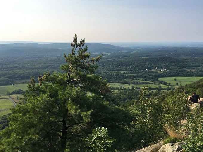 Miles of rolling green valleys spread below like nature's own panoramic screensaver, minus the annoying computer updates.