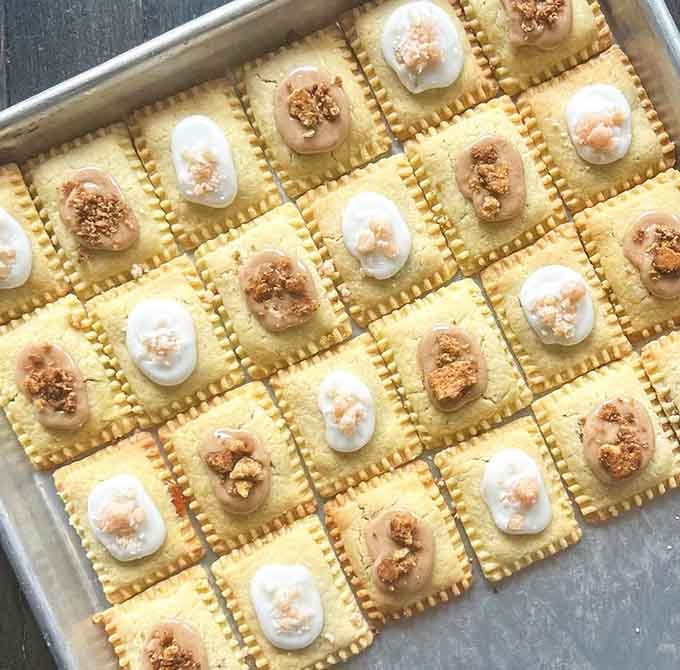 Rows of golden Weeshtarts await their final decorative touches, each one carefully crafted to transform the humble Pop-Tart into something truly extraordinary and delicious.