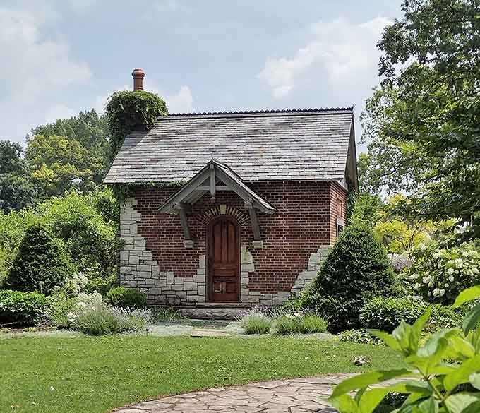 This charming brick cottage looks like it wandered out of a storybook and decided to stay.