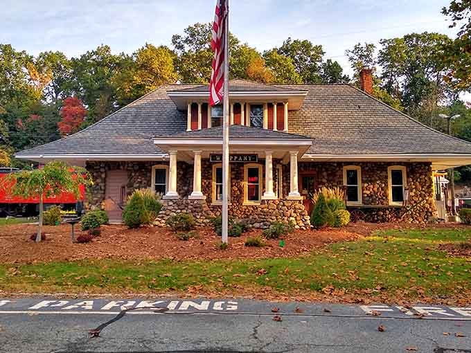 The restored station building welcomes visitors like an old friend, complete with autumn colors and American pride flying high.