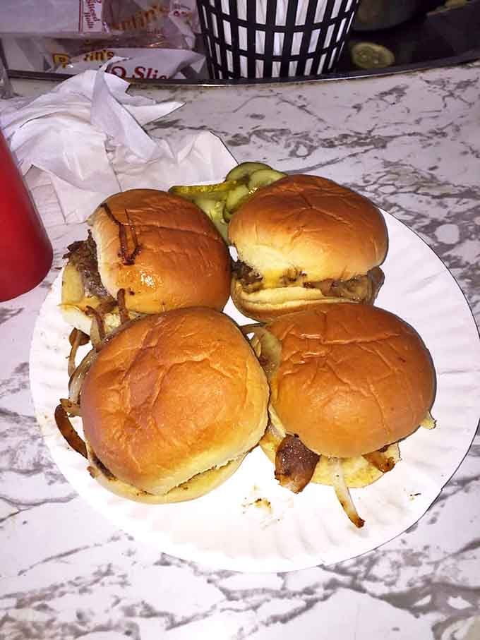 Four golden sliders topped with pickles, proof that heaven exists and it's located in Hackensack, New Jersey.