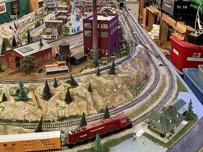 Model trains winding through miniature worlds, making grown adults suddenly understand their uncle's basement obsession completely.