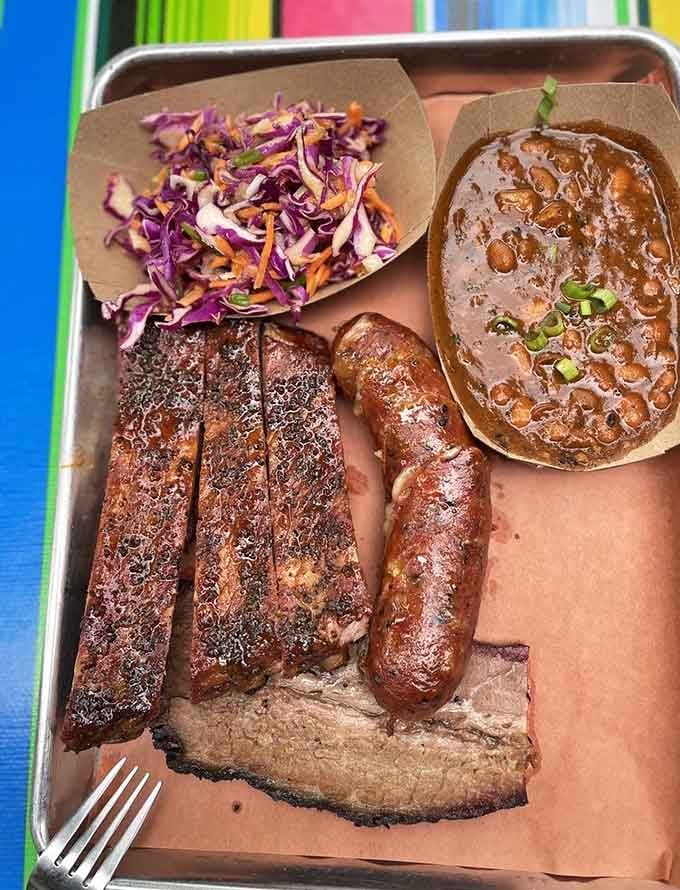 That dark bark and tender meat prove patience pays off when ribs spend hours in the smoker.