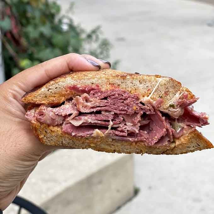 The Reuben at Zingerman's Delicatessen: corned beef piled so high it defies both gravity and reasonable expectations.