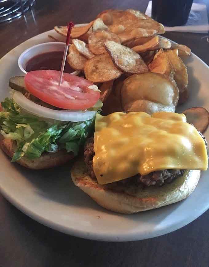 Behold the burger that requires an engineering degree to eat, complete with a mountain of chips.