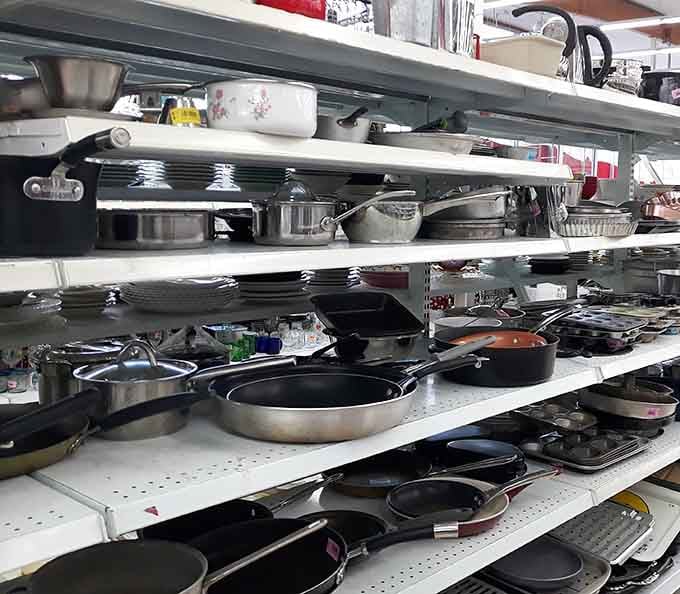 Cookware stacks high like a chef's playground, offering kitchen essentials without the department store markup.