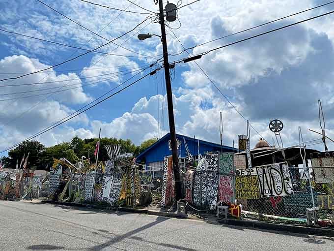 Colorful metal sculptures and painted signs transform an ordinary lot into an explosion of African-inspired creativity and cultural celebration.