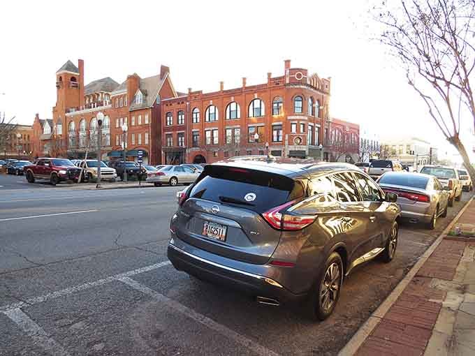 Victorian brick grandeur meets modern parking – this is architecture that knew how to make an entrance and still does.