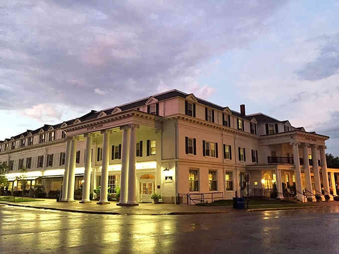 When the evening lights glow against rain-slicked streets, this grand building looks like something from a classic movie.