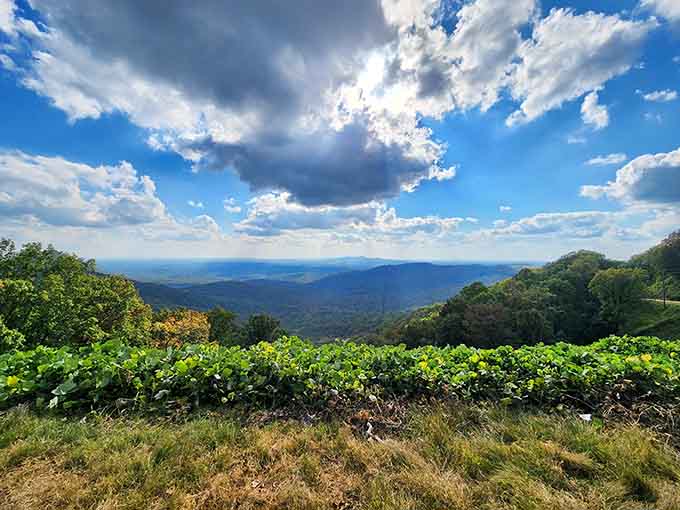 Dramatic clouds part like theater curtains over valleys so lush and green they practically glow in the sunlight.