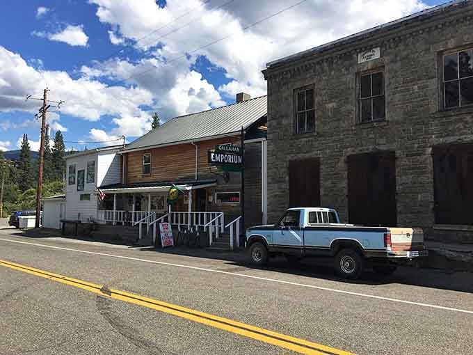 The old Emporium building stands proud beside vintage trucks, a scene straight from every Western movie your dad ever loved.