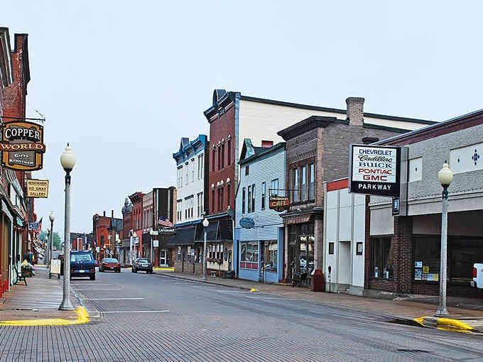 Colorful storefronts line streets wide enough for wagon turns, a reminder of copper boom prosperity and ambition.