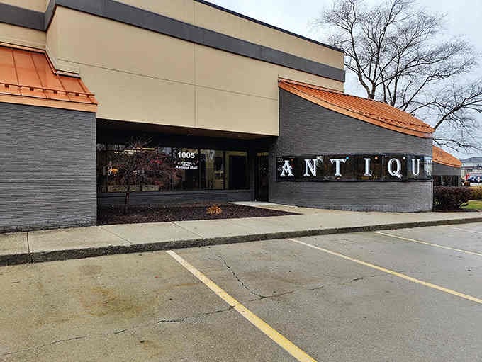 The sleek modern exterior hides decades of history waiting just beyond those dark gray doors.