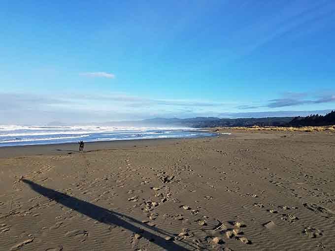 Miles of empty beach stretch toward distant mountains, offering solitude that feels like stepping back in time.