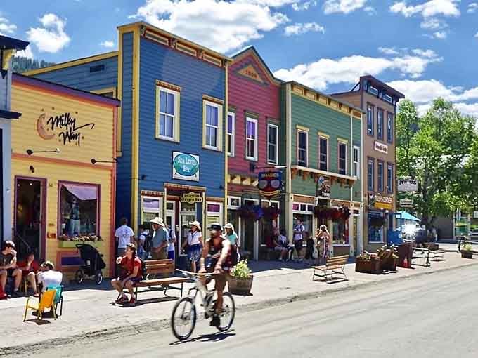 Crested Butte's colorful storefronts pop against blue summer skies like a cheerful rebellion against boring beige buildings everywhere.