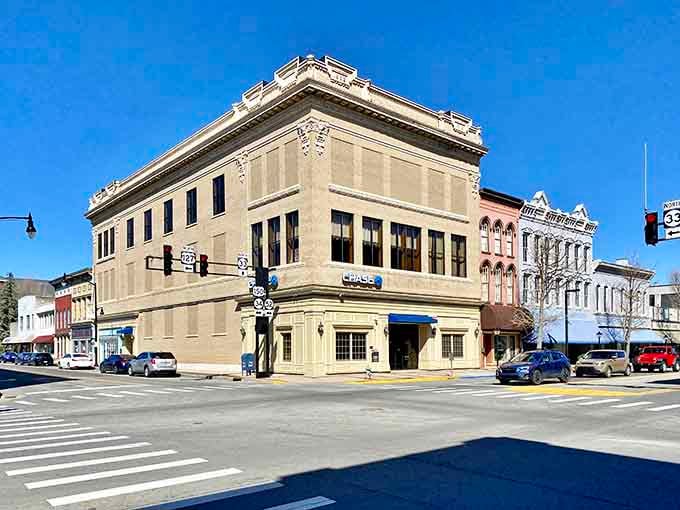 That grand corner building stands like a sentinel of history, its limestone facade reminding us that quality craftsmanship never goes out of style.