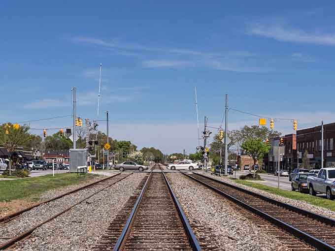 Railroad tracks stretch through town like ribbons of history, reminding you this place has always been about connections.