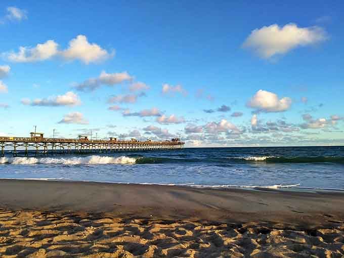 The wooden boardwalk leads to turquoise waves that could make the Caribbean jealous of this coastline.
