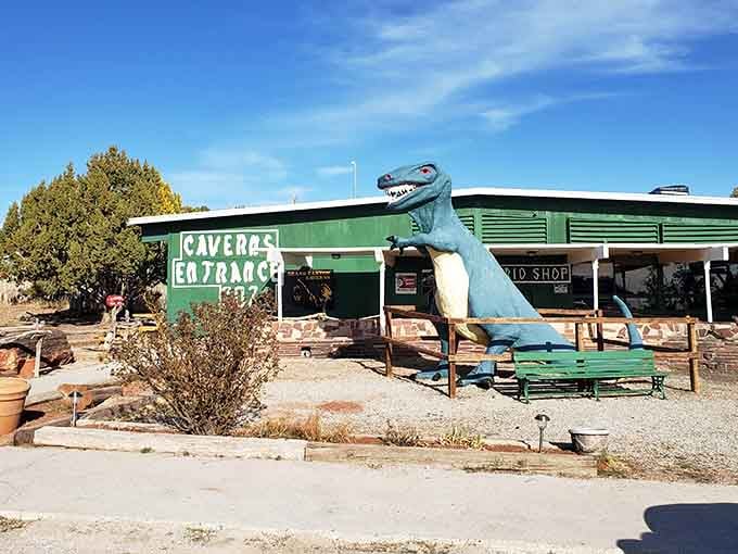 That cheerful blue dinosaur greeting visitors proves even prehistoric creatures appreciate a good roadside attraction with character.