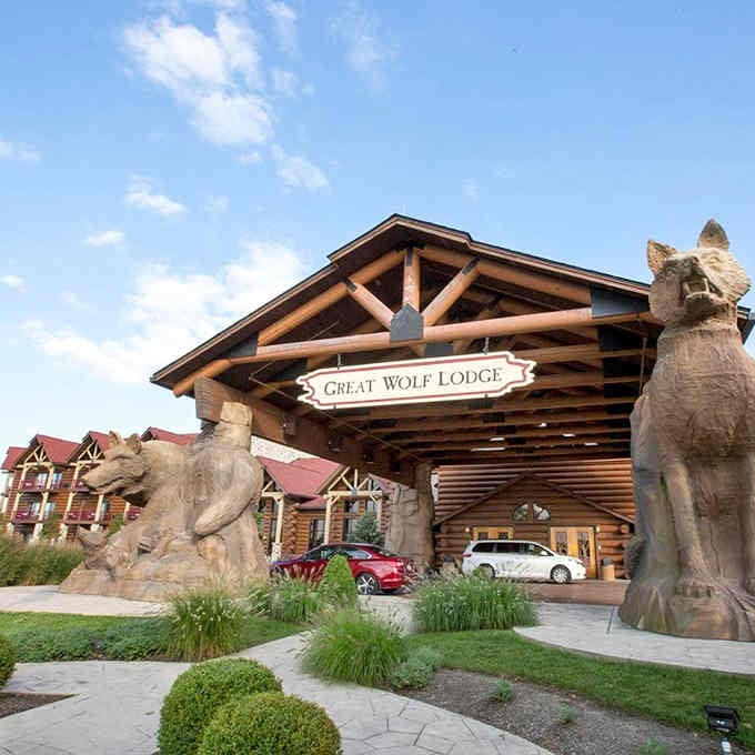 Those carved wolf statues standing guard at the lodge entrance set the tone for wilderness adventures ahead.