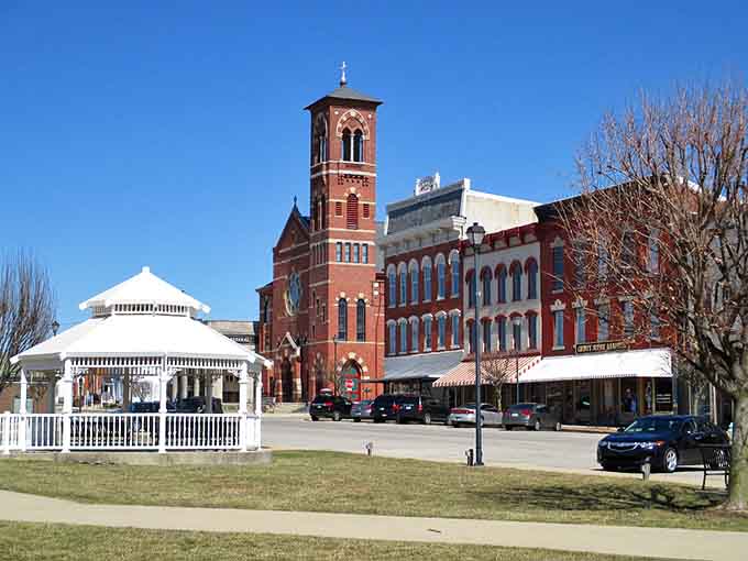 The white gazebo and red brick tower create a postcard-perfect scene that Instagram wishes it invented first.