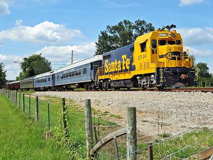 That cheerful yellow Santa Fe engine leading silver passenger cars looks ready for a Hollywood close-up today.