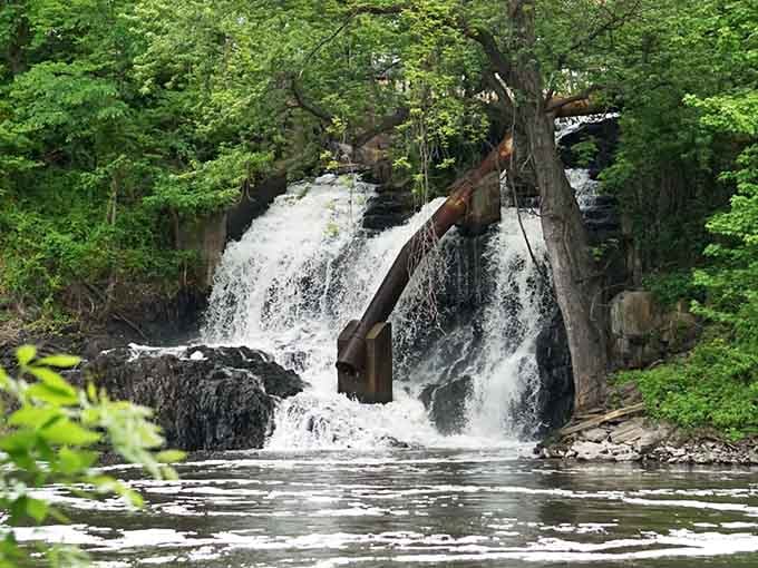 Water rushes over weathered timbers and stone, creating a scene that's part nature documentary, part history lesson.
