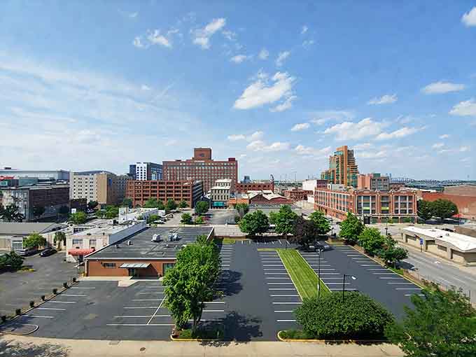 From above, the city spreads out with a mix of historic charm and modern growth under endless skies.