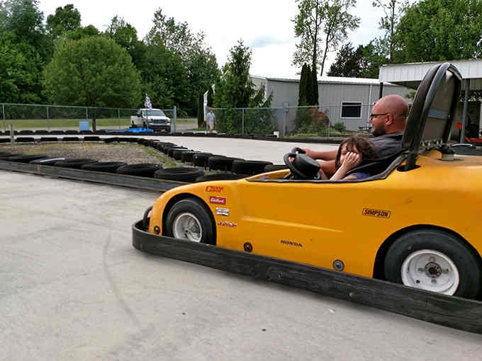 Sunshine-yellow kart hugging the outdoor track proves you're never too old to feel like a kid again.