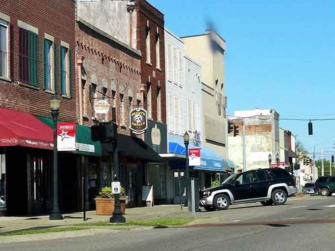 These storefronts wear their age like badges of honor, each brick telling stories from decades past.