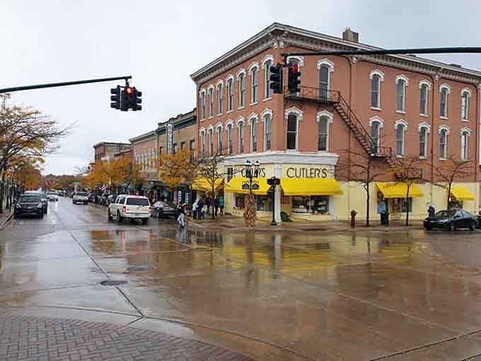 Petoskey's brick corner building anchors a wet street where fall colors paint the perfect small-town tableau.