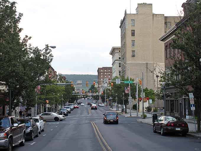 Pottsville's tree-lined main street features classic storefronts and historic buildings, creating a welcoming downtown perfect for leisurely afternoon strolls and shopping.