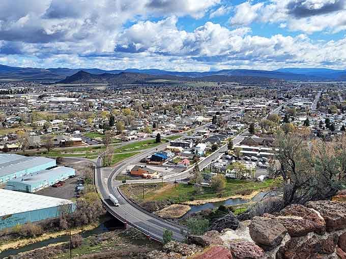 From this bird's-eye view, the town spreads out like a patchwork quilt beneath dramatic skies.