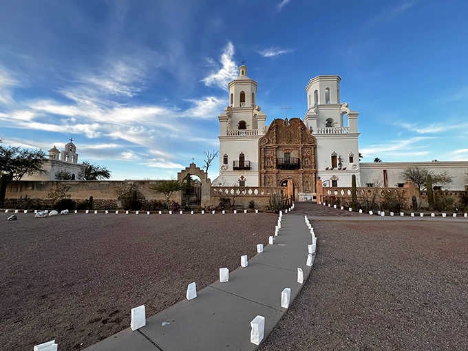 White luminarias line the pathway to this gleaming mission, creating a scene worthy of any classic Western film.