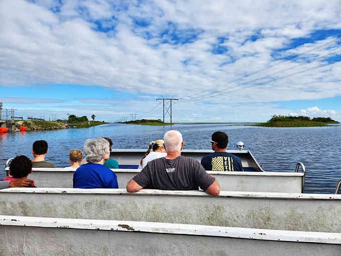 Families gather on the airboat dock, ready to explore waterways that wind through endless sawgrass like nature's maze.