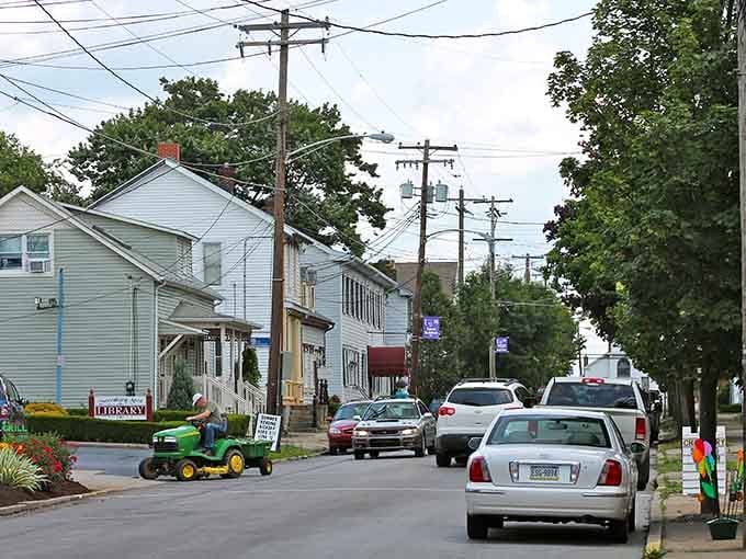 Only one person riding a lawn mower down the street, which means it's either Tuesday or Saturday here.