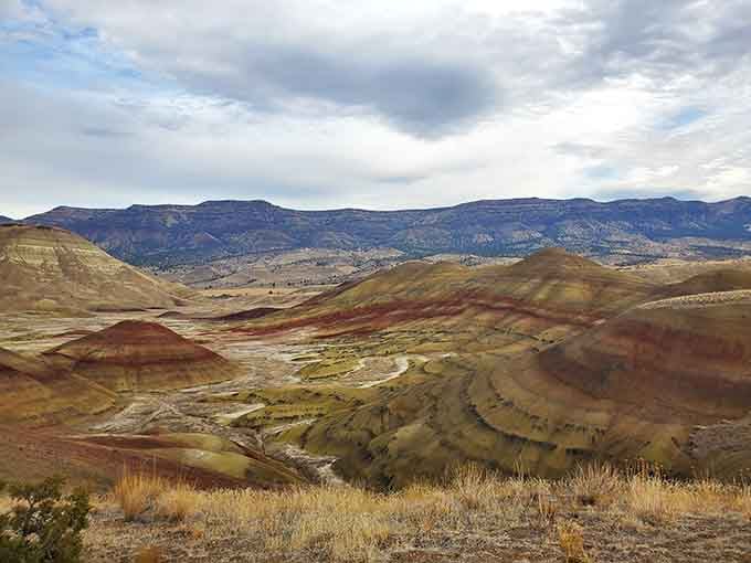 These painted hills look like someone spilled a giant box of crayons across the desert landscape millions of years ago.