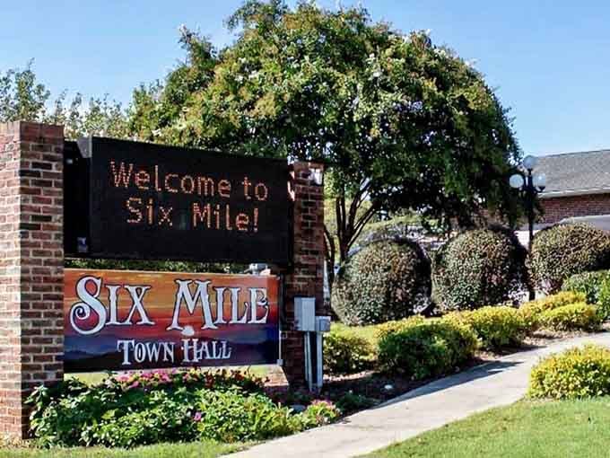 The welcome sign says it all: Six Mile knows exactly what it is and couldn't be happier.