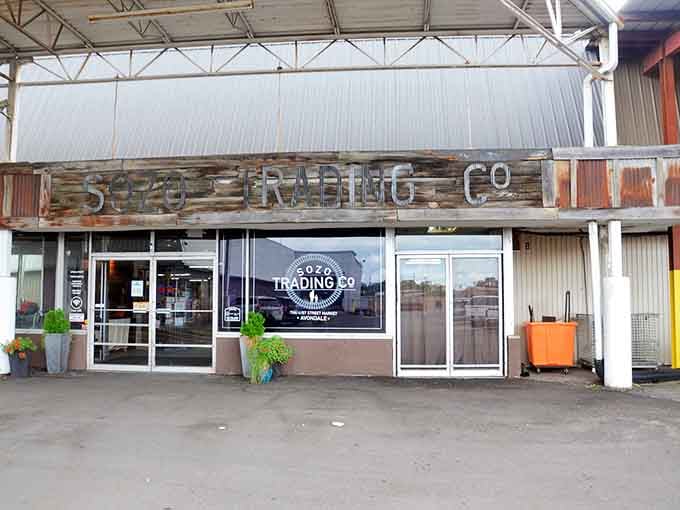 The rustic reclaimed wood facade hints at the curated vintage finds and unique pieces waiting inside this industrial-chic shopping destination.
