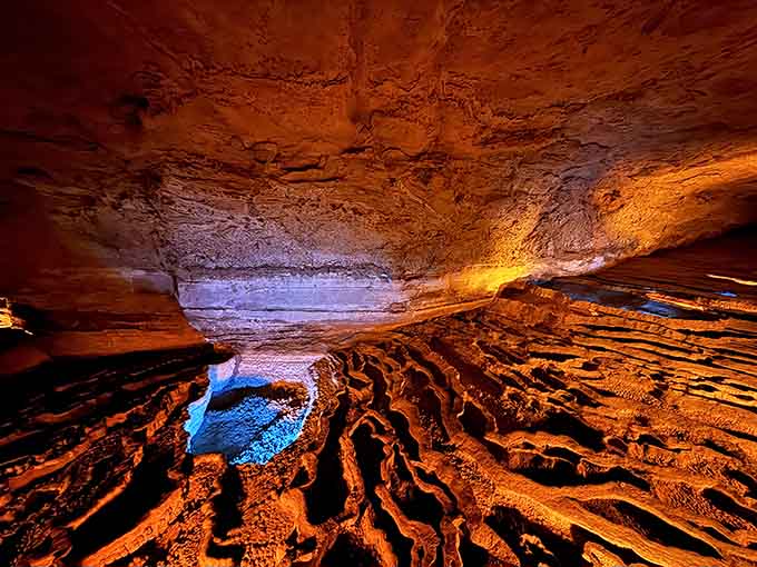 Rippled cave floors glow amber and violet, creating an alien landscape that's been hiding beneath Indiana farmland all along.
