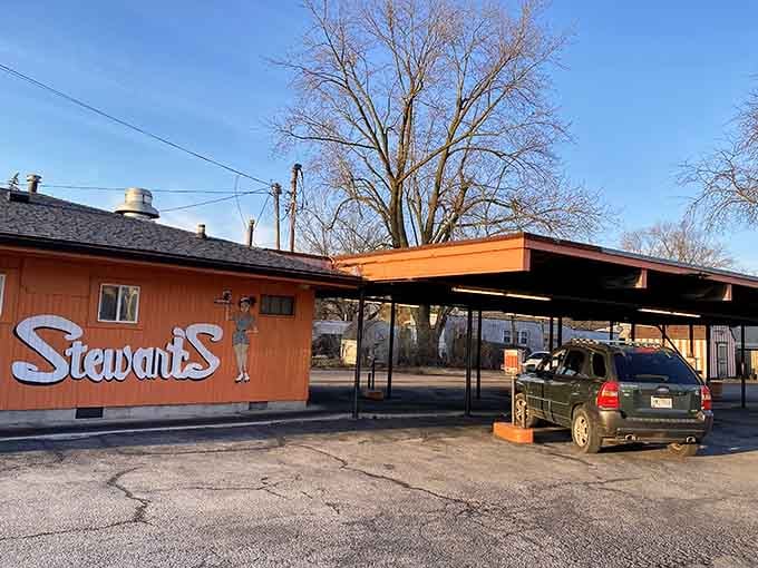 That orange building and vintage canopy create the perfect backdrop for making memories one burger at a time.