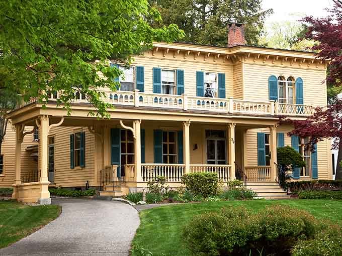 This butter-yellow mansion with its ornate balconies looks like it stepped straight out of a Gilded Age dream.