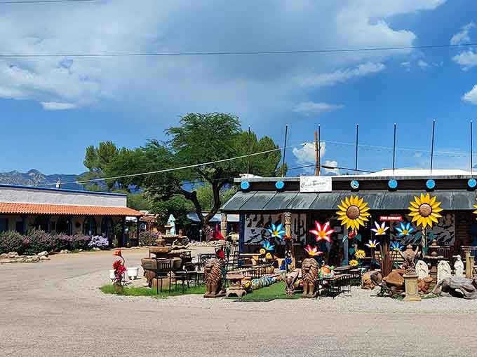 Giant sunflowers and colorful folk art transform this outdoor space into a cheerful celebration of creativity and whimsy.