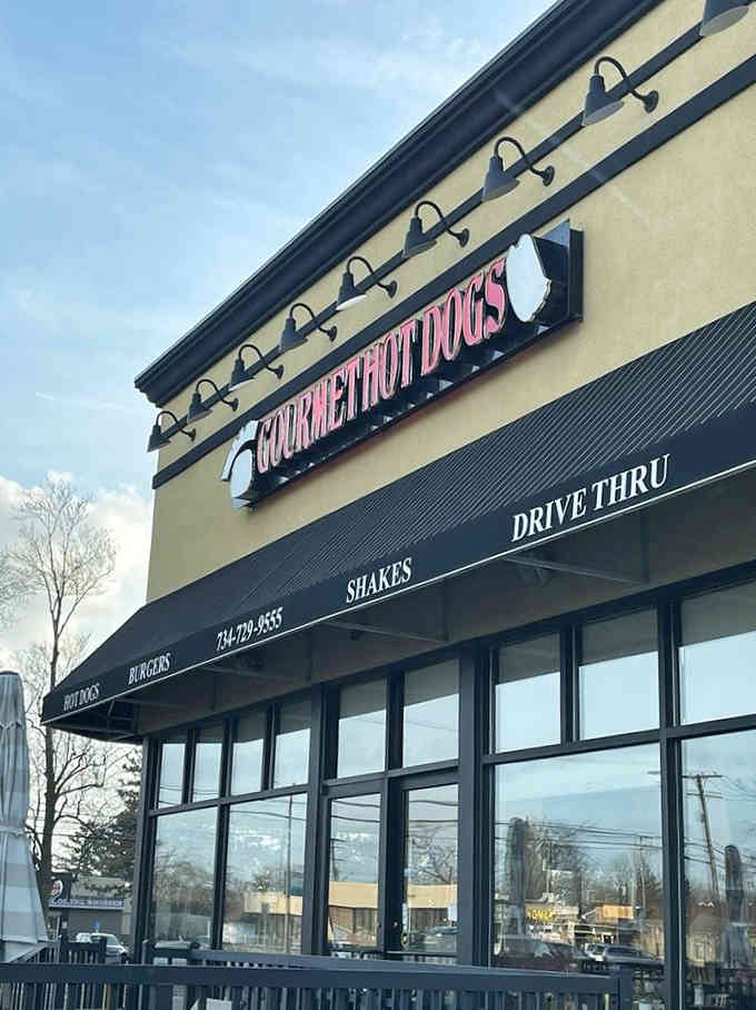 Those big windows and modern black awnings signal that gourmet hot dogs have arrived with style and substance to spare.